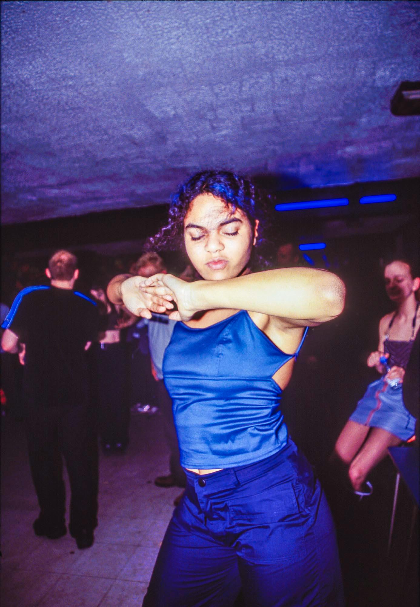 Early 2000s nightlife in all its chaotic, shiny glory