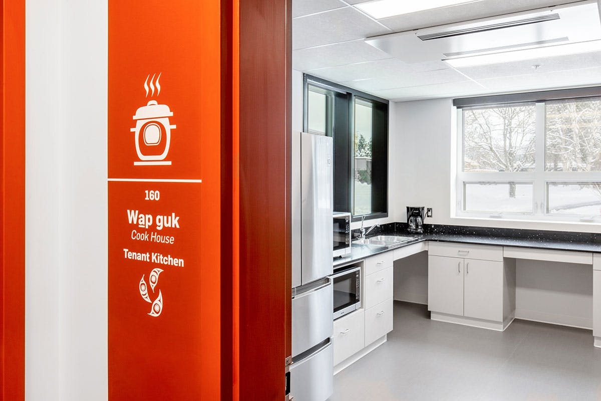Indigenous art guides signage for this Canadian housing project